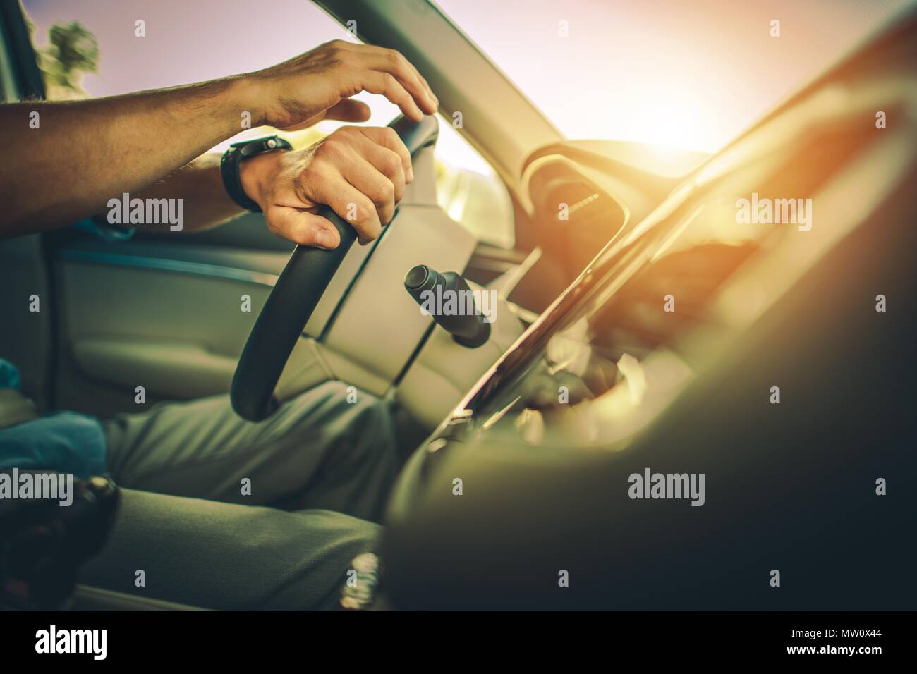 Driver Behind the Wheel. Modern Car Driving Theme Stock Photo - Alamy