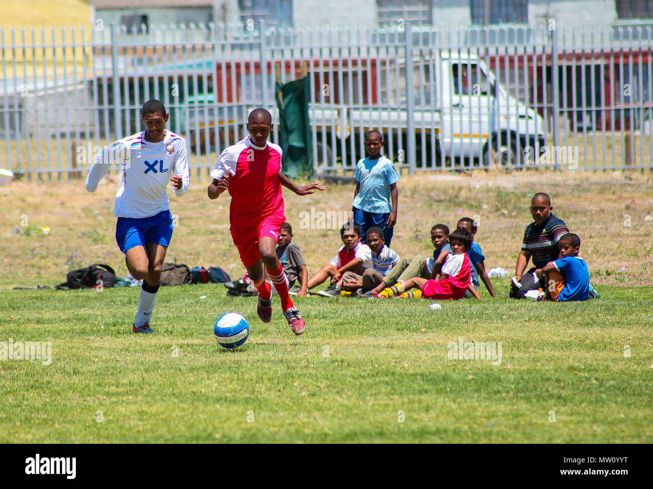 Multicultural children playing football hi-res stock photography and ...