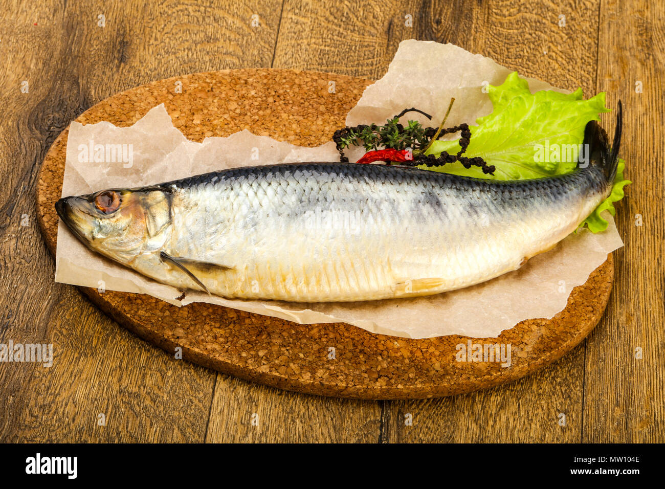 Salted Herring fish with pepper and spices Stock Photo - Alamy