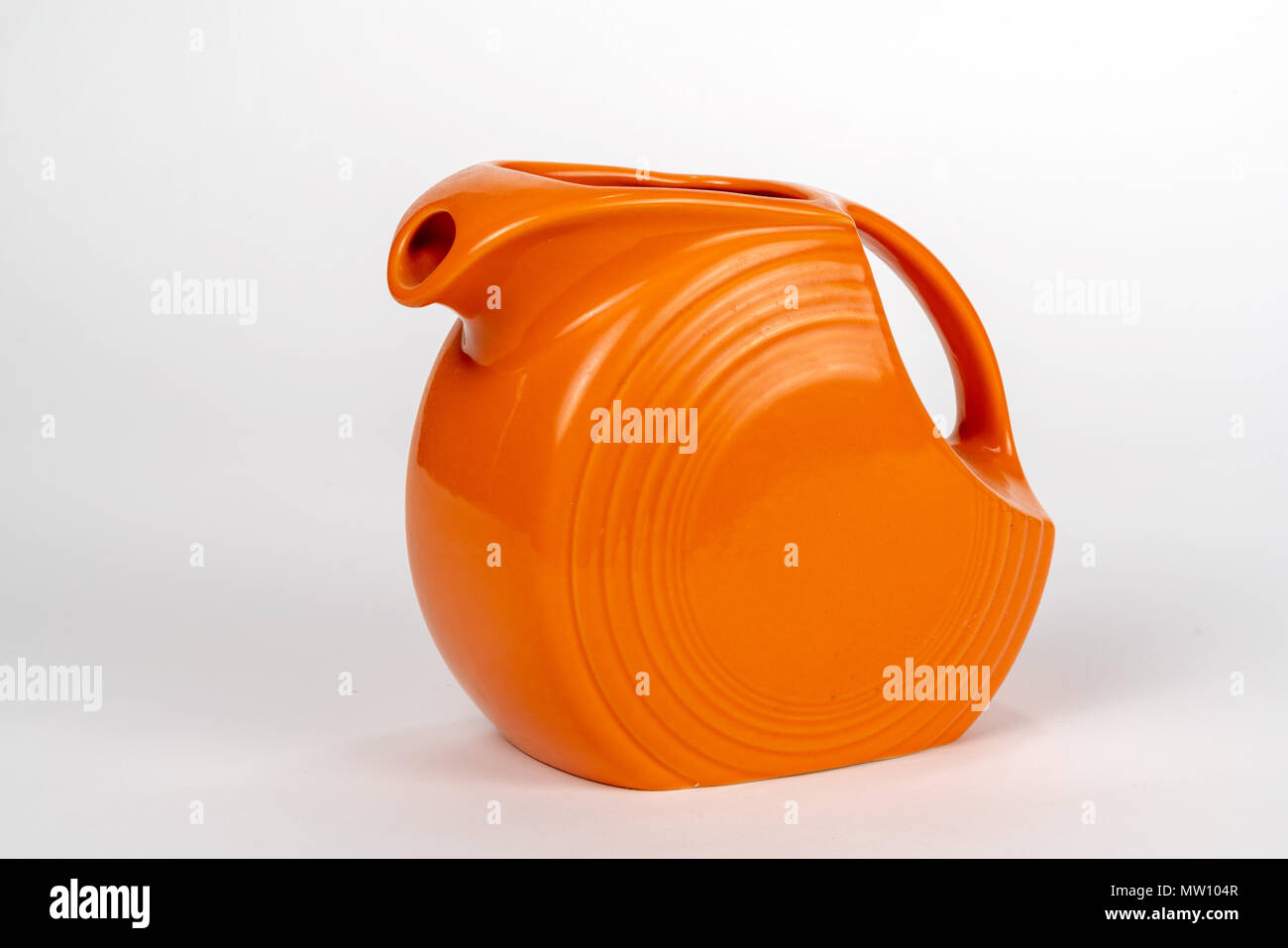 Orange Pitcher with Handle isolated Stock Photo - Alamy