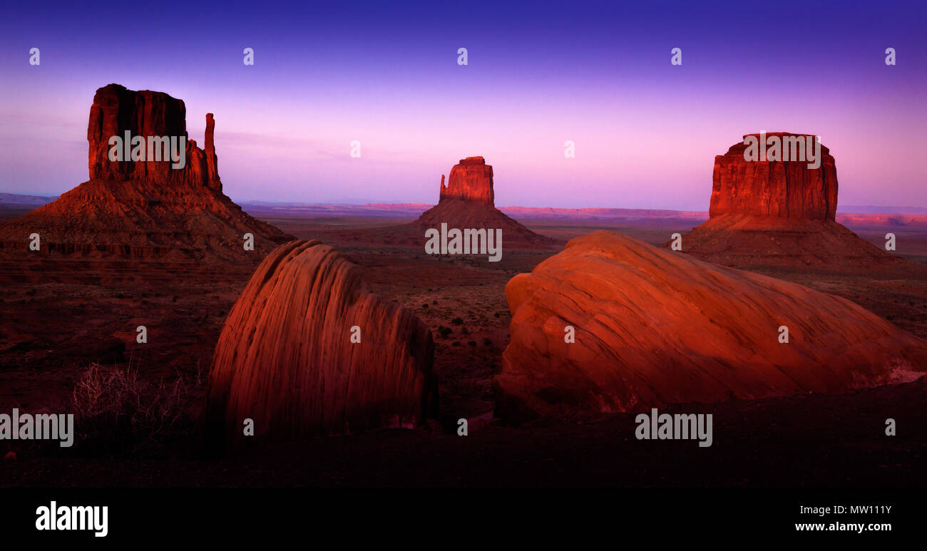 Monument Valley Landscape with Purple Skies andRed Rock Formations ...