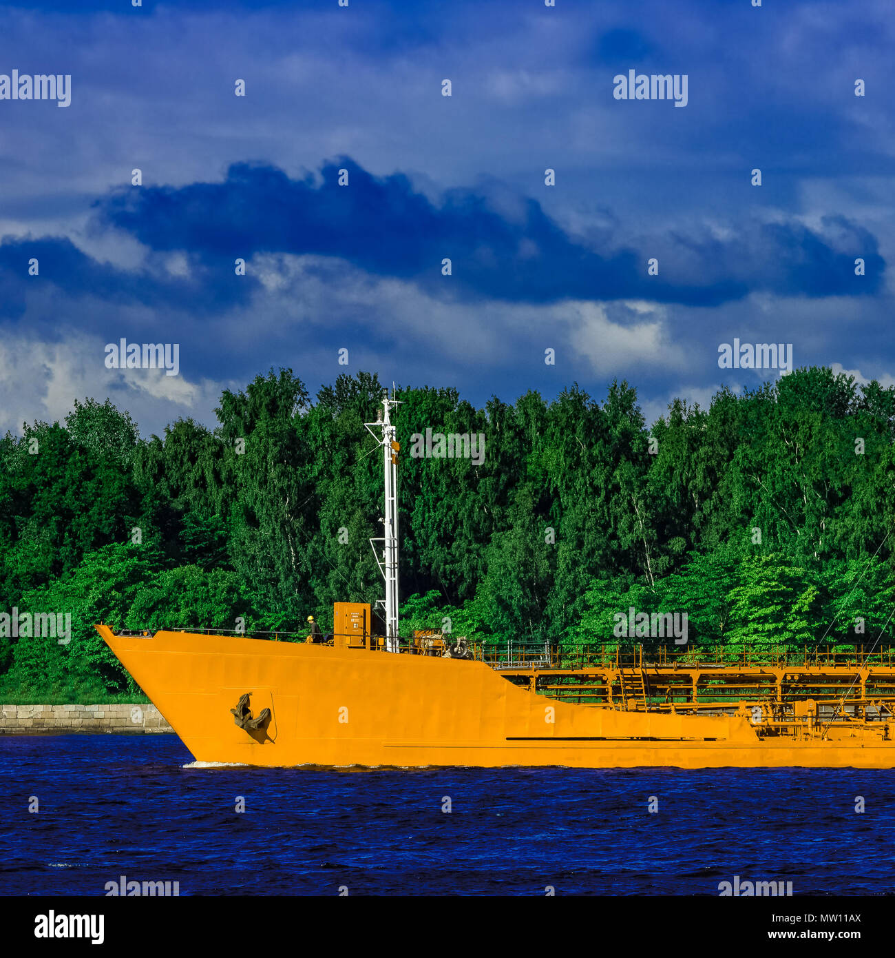 Yellow cargo tanker ship moving at the clear summer day Stock Photo - Alamy