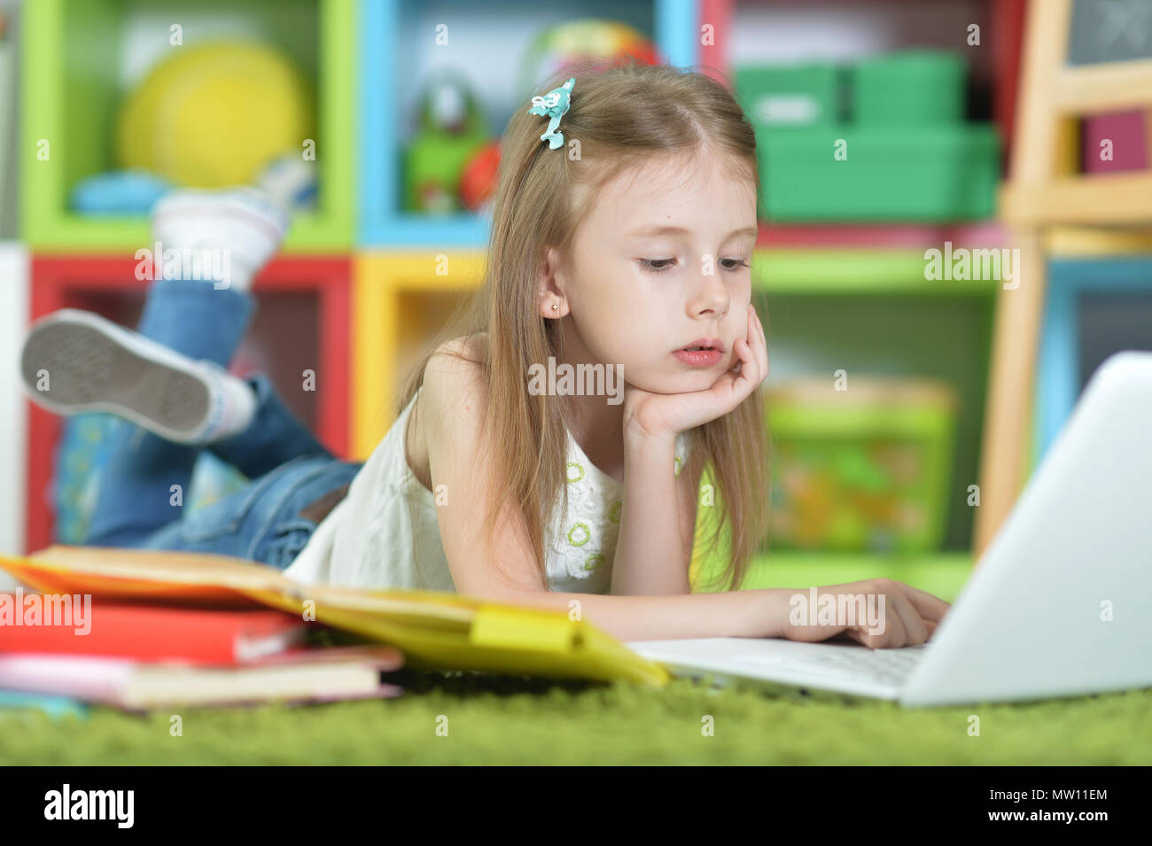Cute schoolgirl doing homework Stock Photo - Alamy