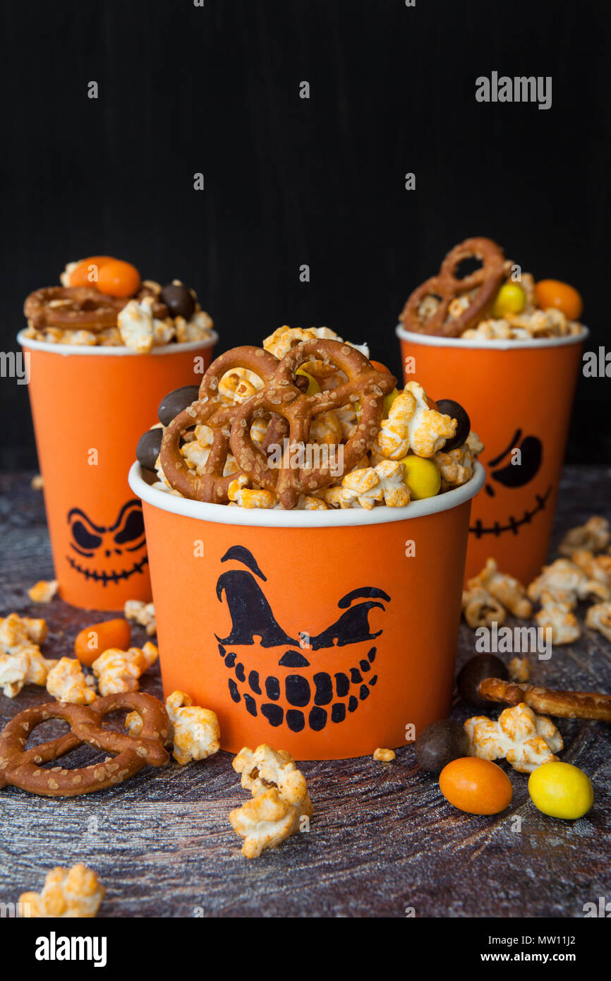 Salty Popcorn for Halloween with scary pumpkin faces Stock Photo - Alamy