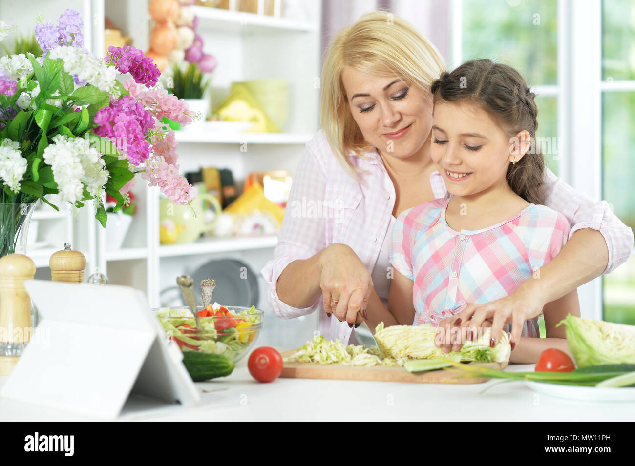 mother and daughter cooking together Stock Photo - Alamy
