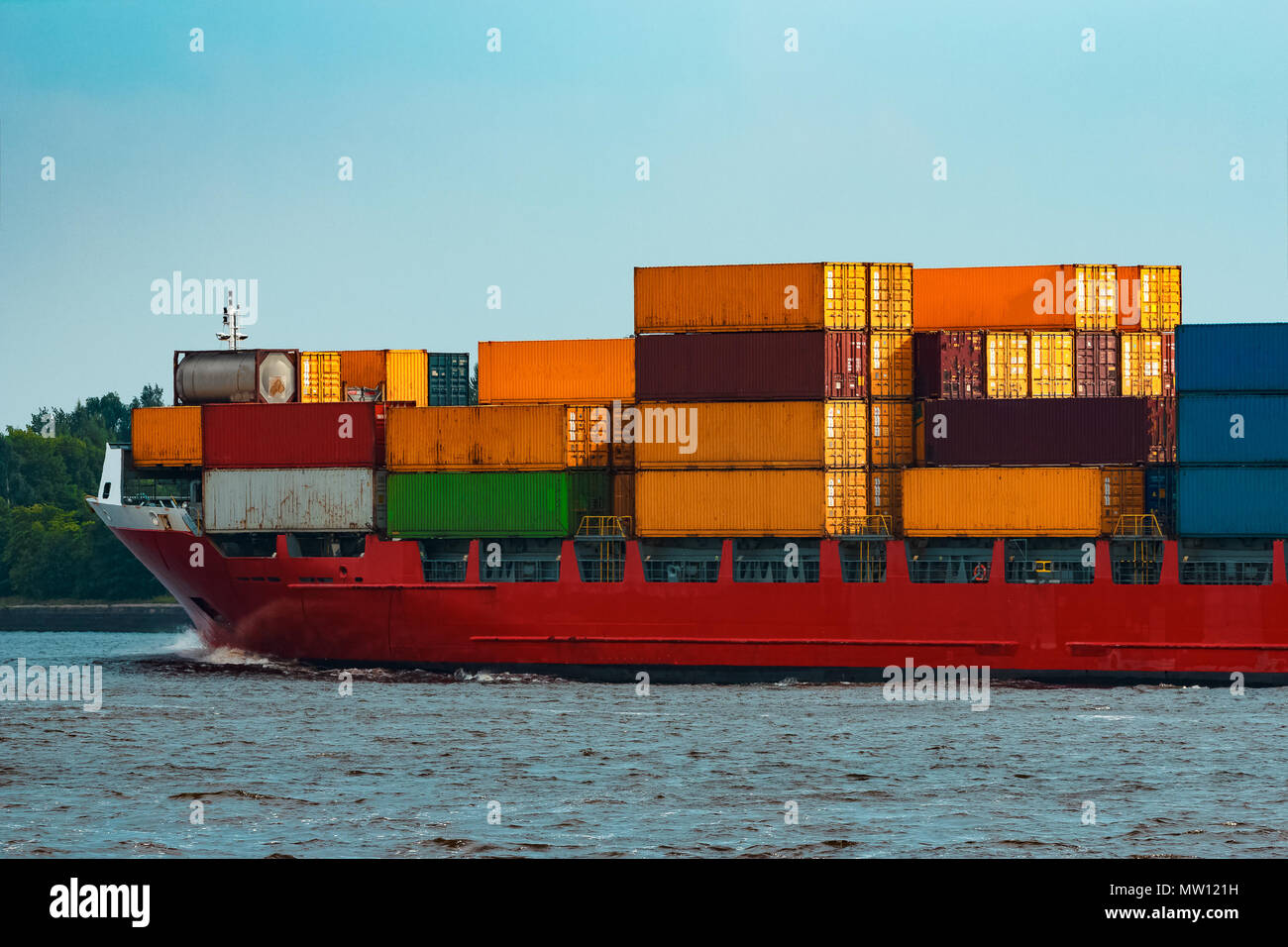 Red container ship. Logistics and production transfer Stock Photo - Alamy