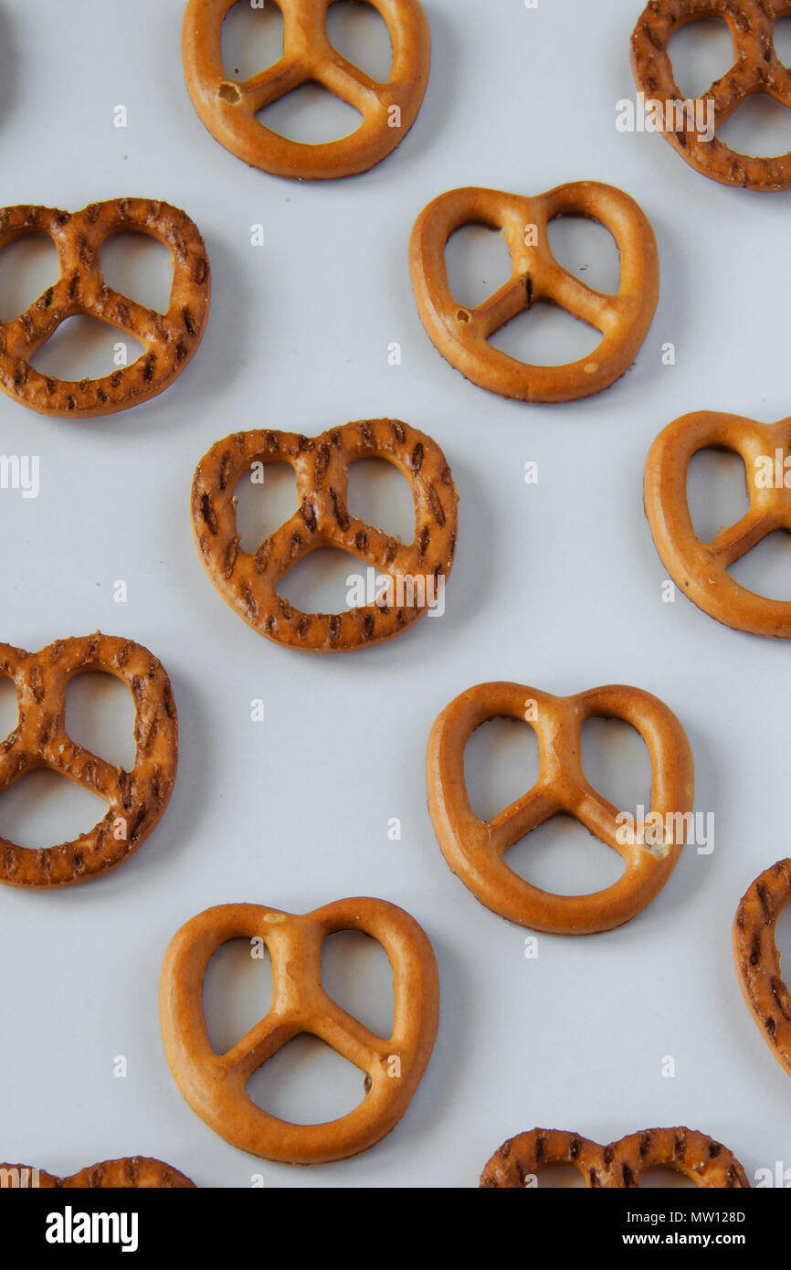 Food pattern- salty snacks/crisps on white background Stock Photo - Alamy