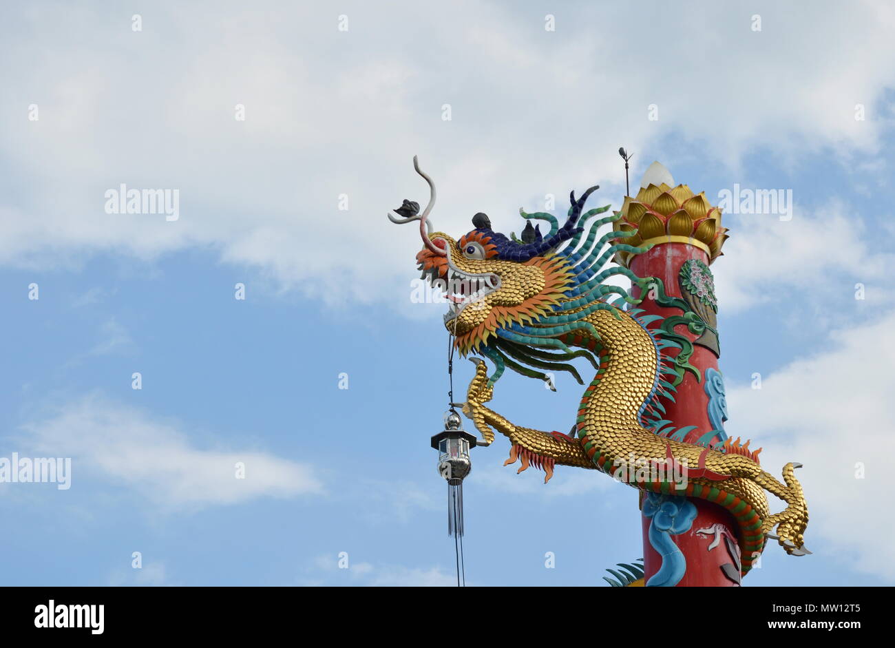 Chinese dragon statue roll over the pole Stock Photo - Alamy