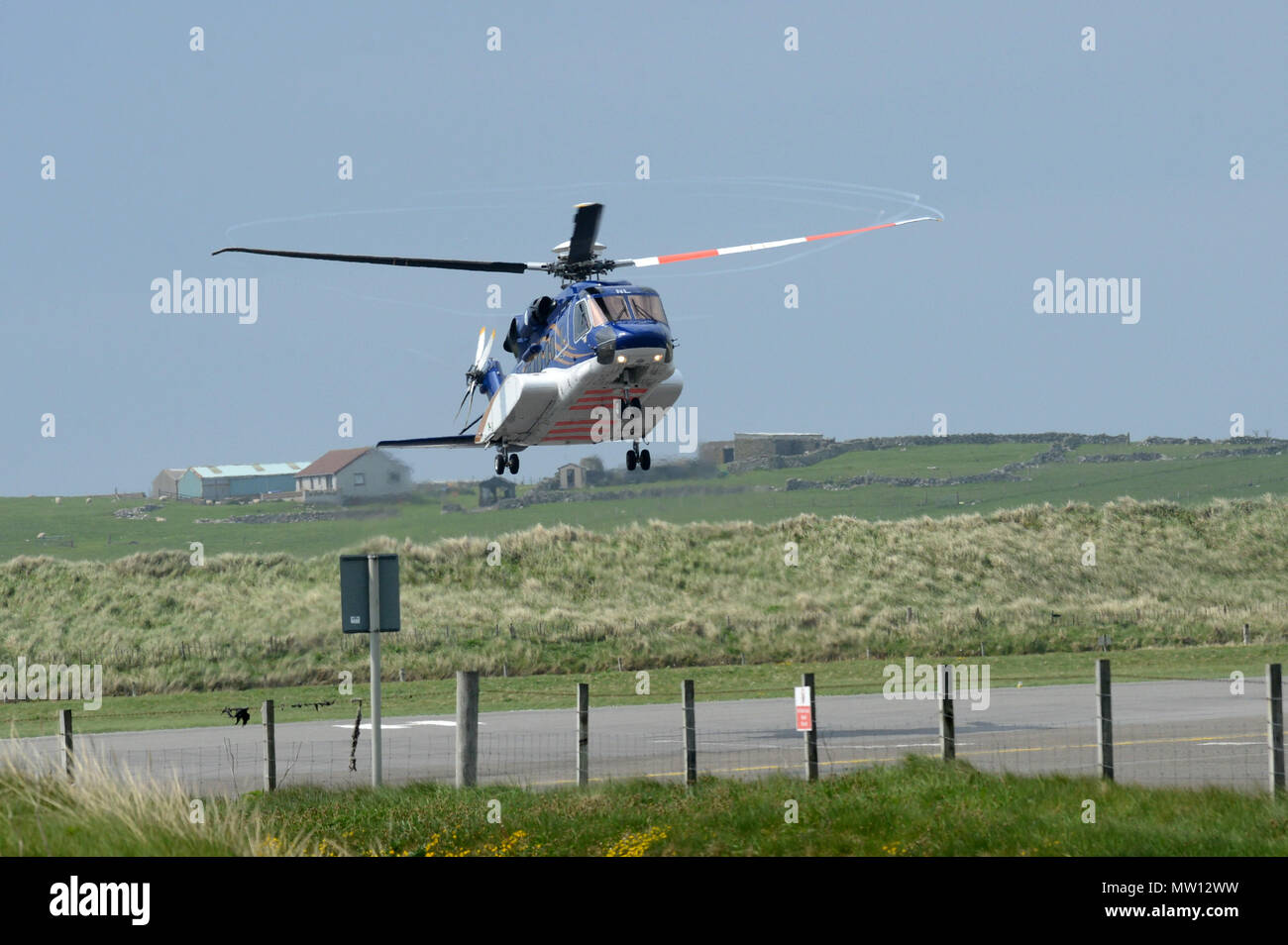 Offshore oil and gas workers travelling to and from work by helicopter ...