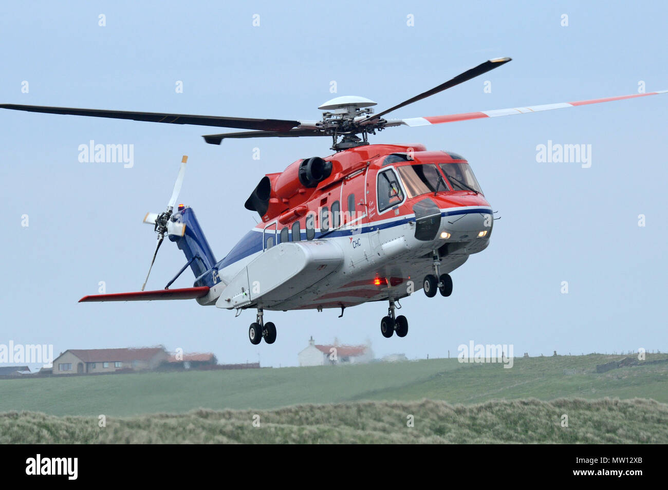 Offshore oil and gas workers travelling to and from work by helicopter ...