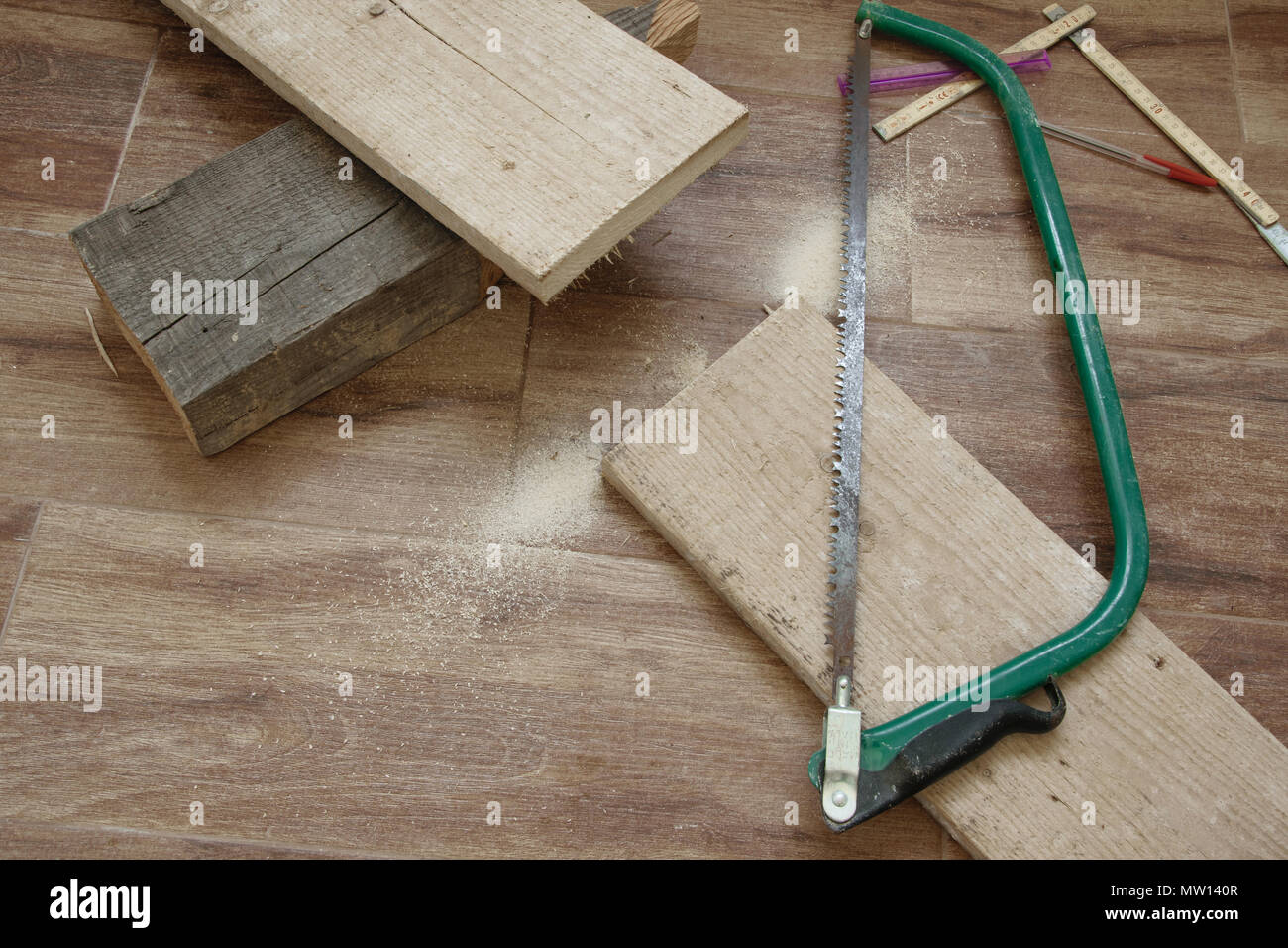 Top view of woodwork tool -saw, and wooden plank Stock Photo - Alamy