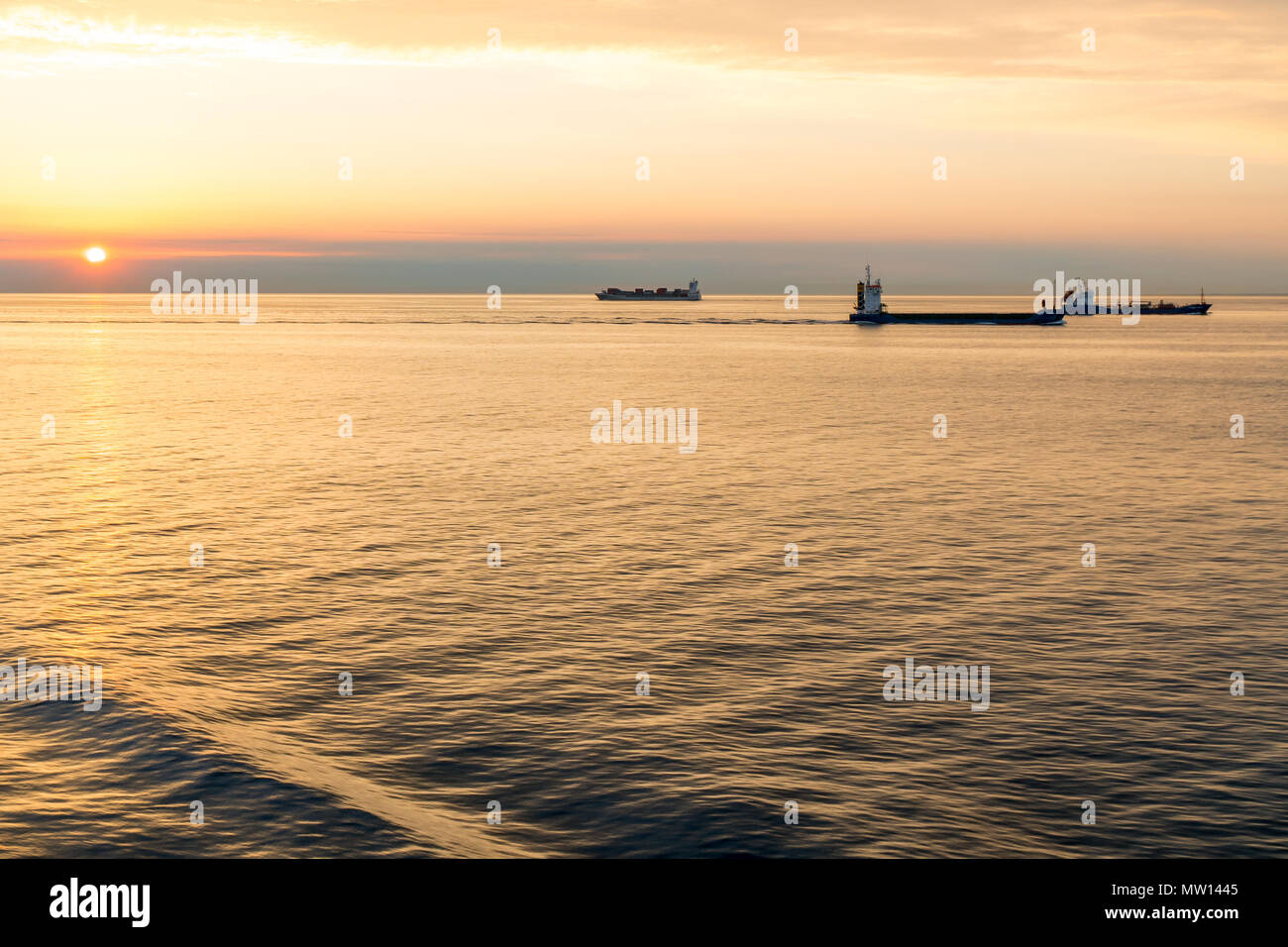 Container ship during sunset hi-res stock photography and images - Alamy