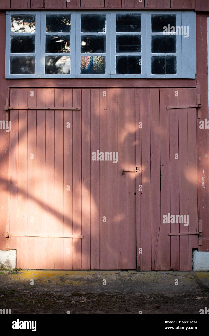 Red large door with glass window Stock Photo - Alamy