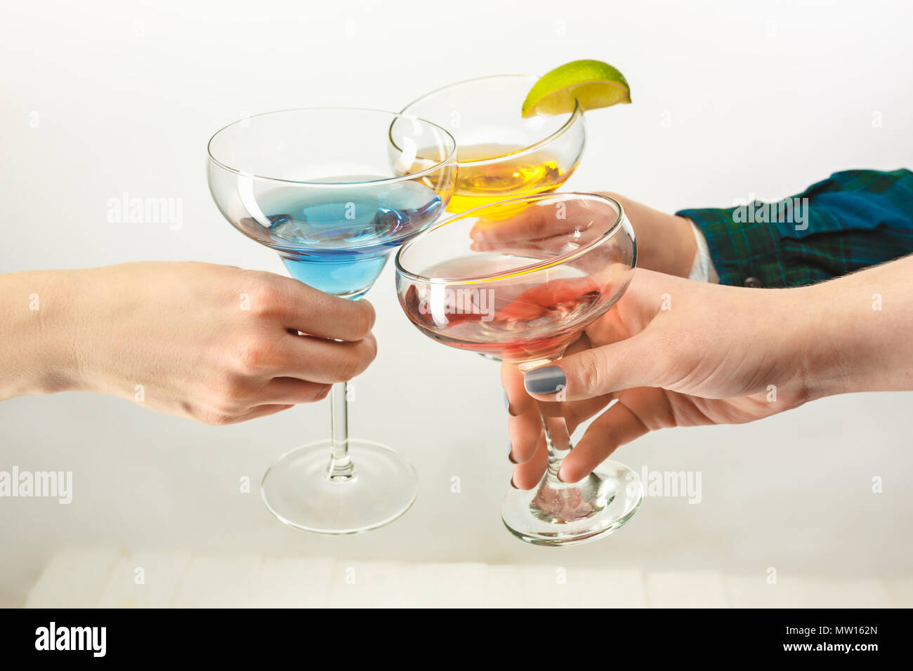 The male and female hands with exotic cocktails Stock Photo - Alamy