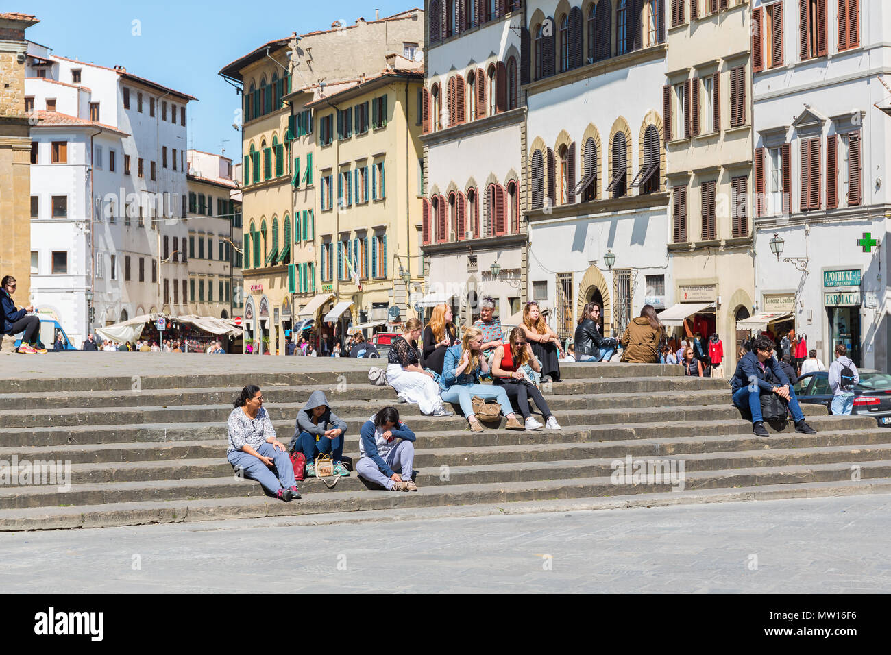 People sitting and resting on a staircase Stock Photo - Alamy