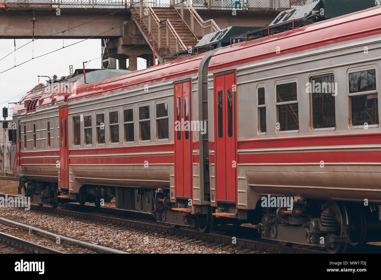 Red diesel passenger train driving at the old terminal Stock Photo - Alamy