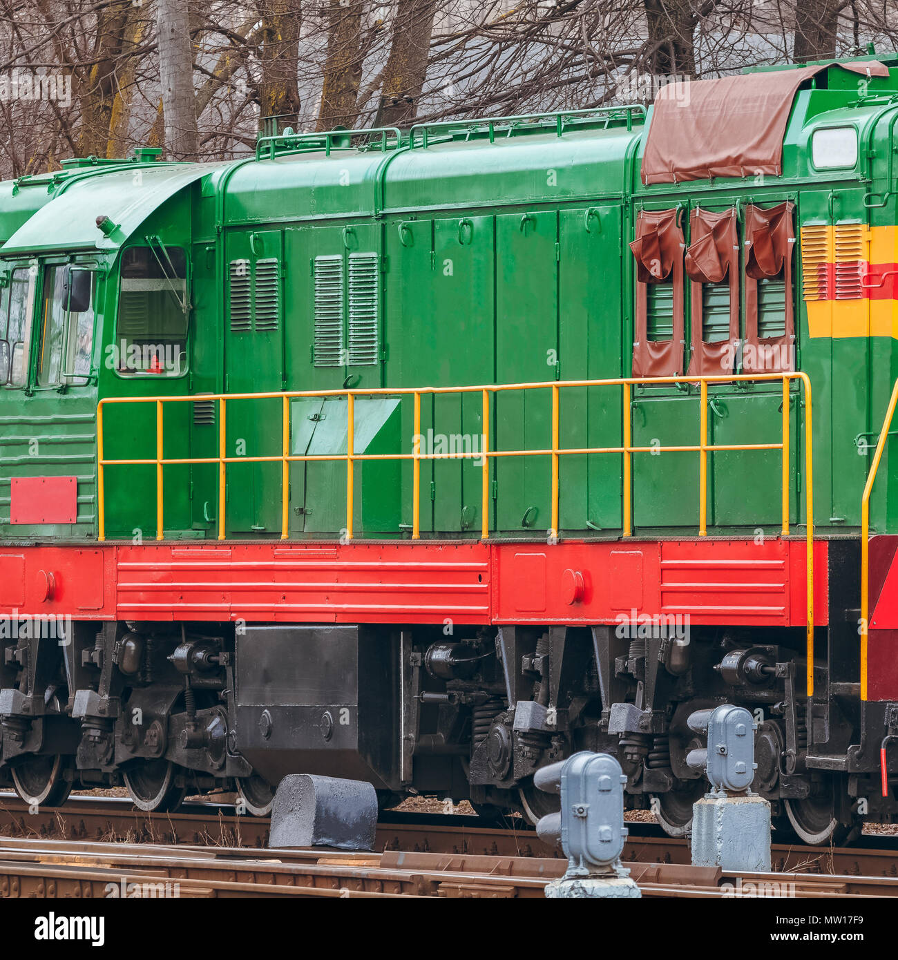 Green diesel cargo locomotive. Freight train in action Stock Photo - Alamy