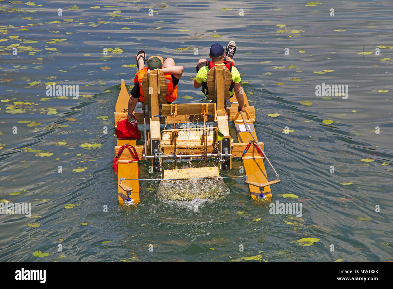 Two man ride with floating pedal bicycle boats across the lake Stock ...