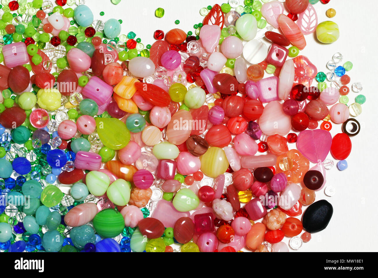 Beads of different kinds mixed close up photo Stock Photo - Alamy