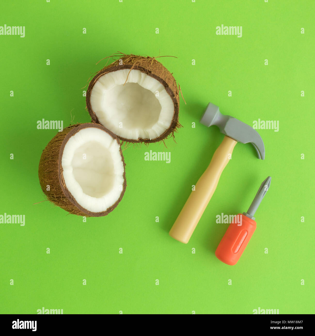 Coconut breaking equipment minimal creative concept Stock Photo - Alamy