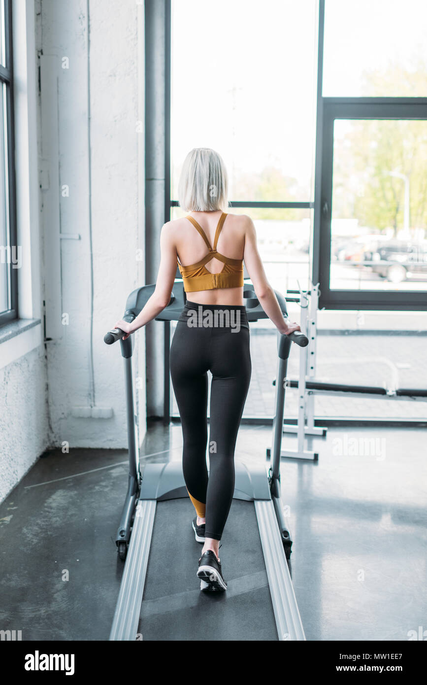 Back view girl on treadmill hi-res stock photography and images - Alamy