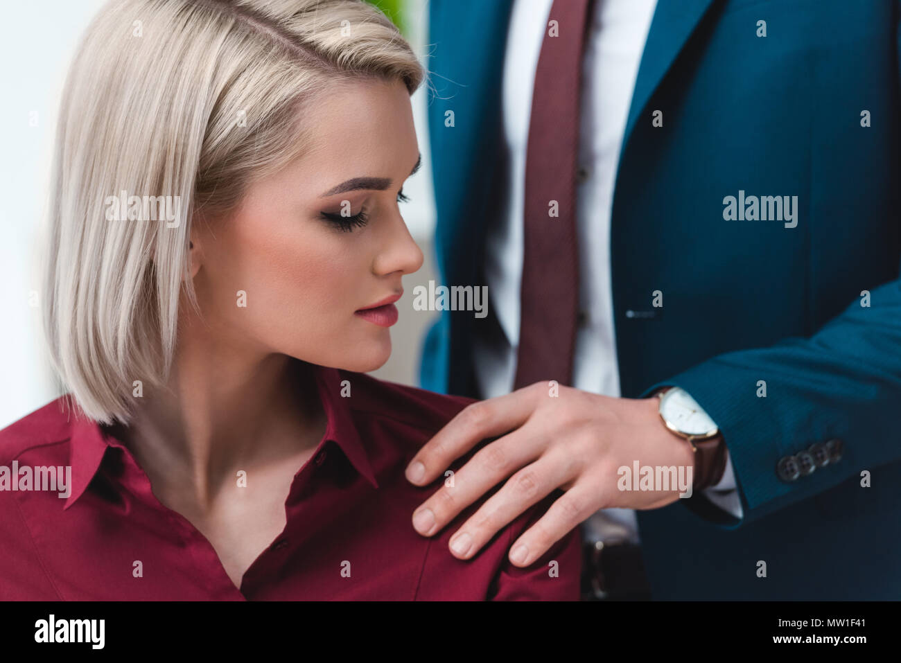 cropped shot of businessman flirting with beautiful young female ...