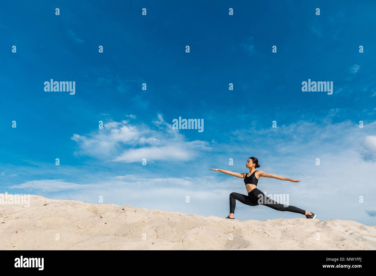 Slim girl yoga warrior pose hi-res stock photography and images - Alamy