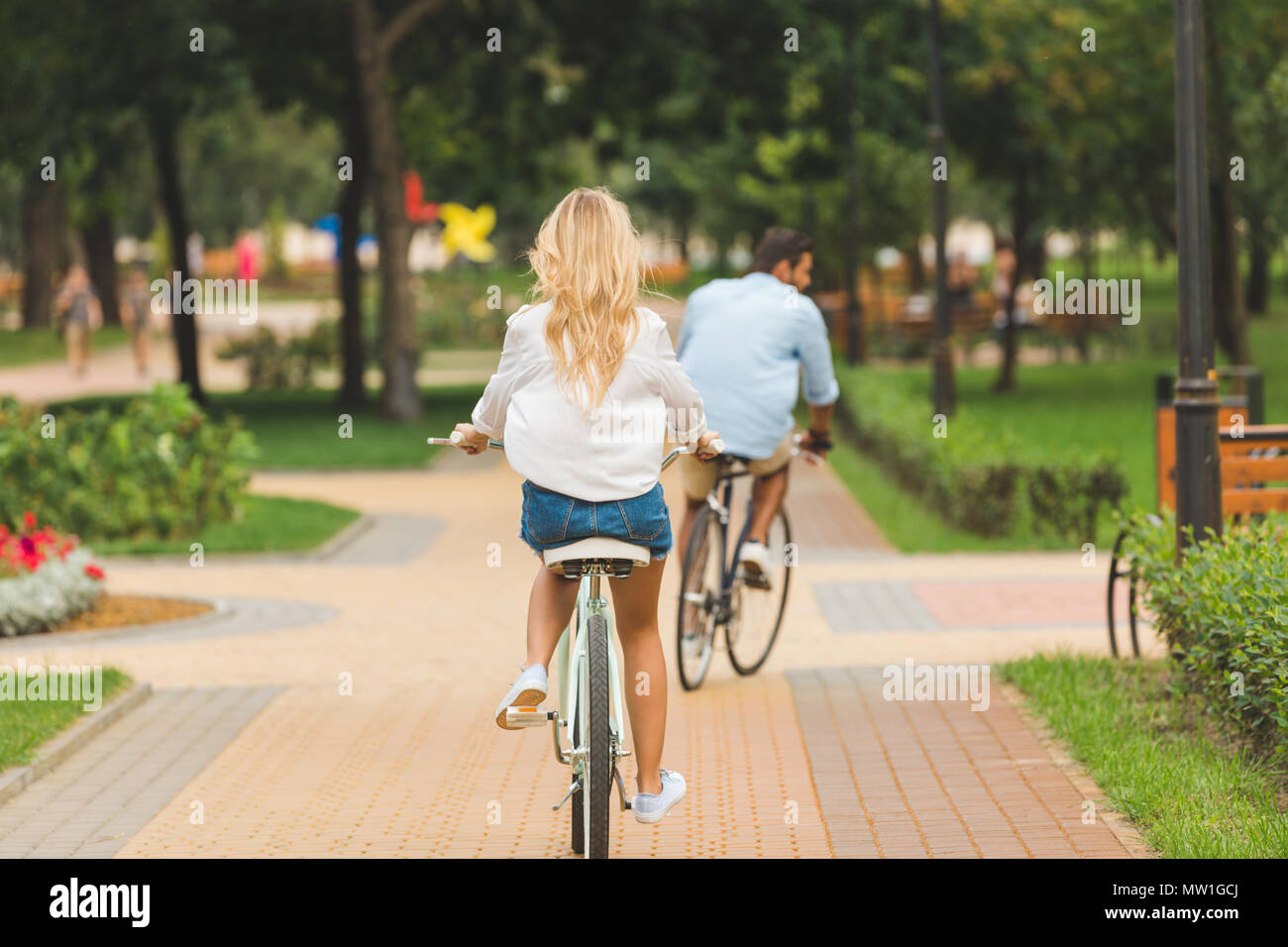 Woman riding bicycles hi-res stock photography and images - Alamy