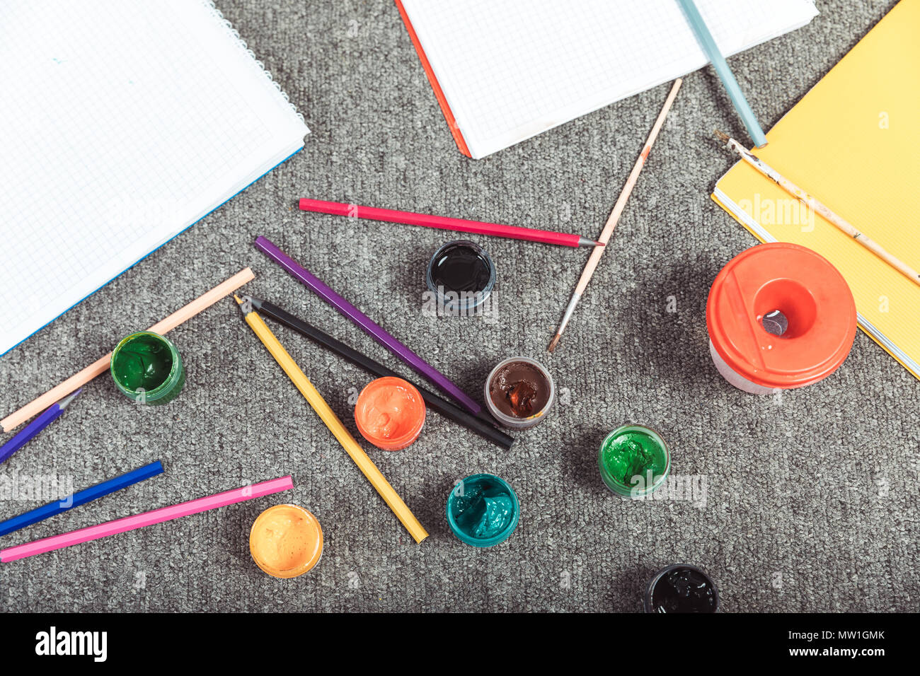 top view of blank drawing albums, paints and brushes on carpet Stock ...