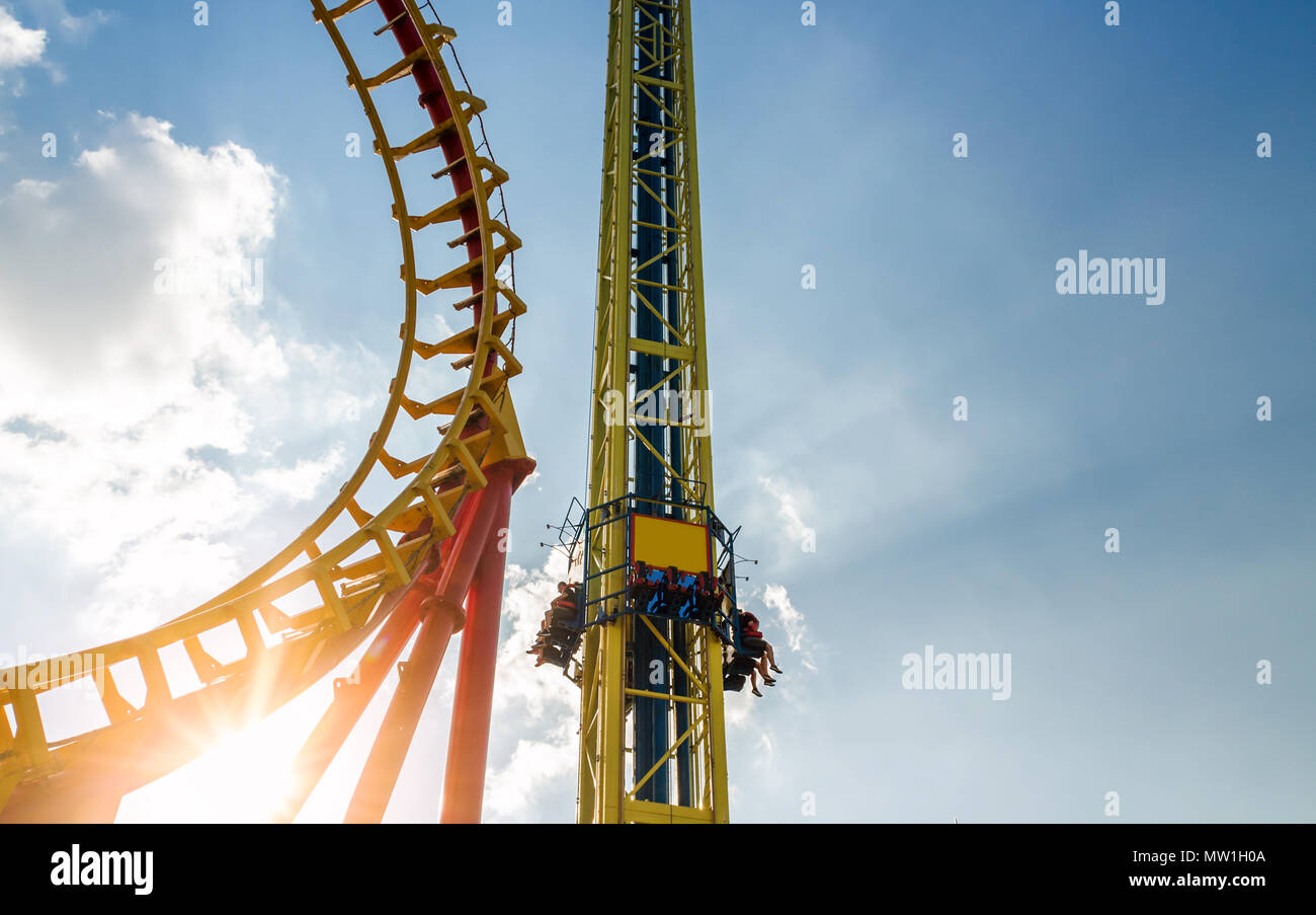 Amusement park ride, people having a ride in vertical catapult at ...