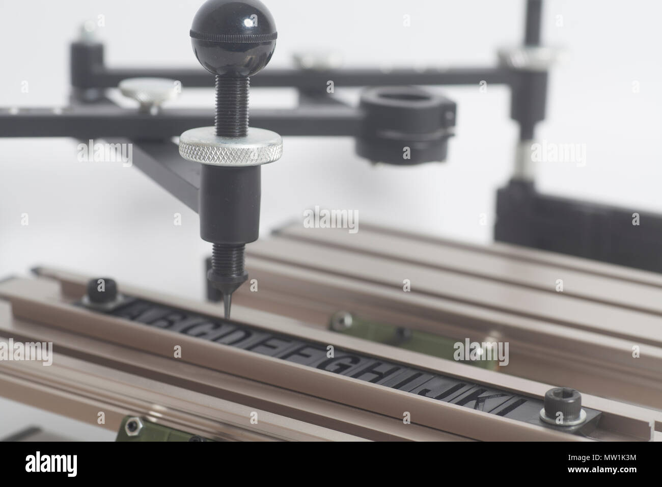 Pantograph engraving device with letterpress alphabet on a white ...