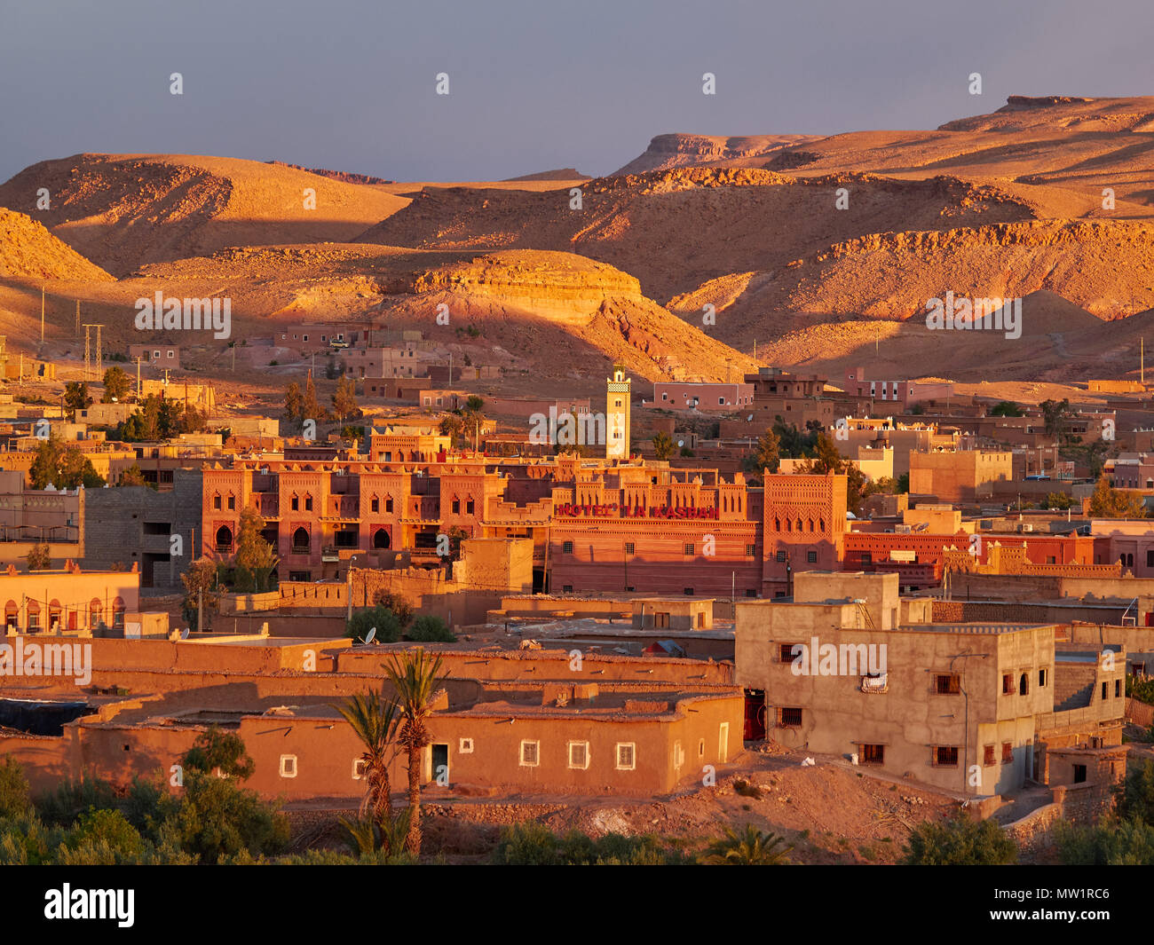 Sunset in city of Tingir: pink clay houses on a background of pink ...