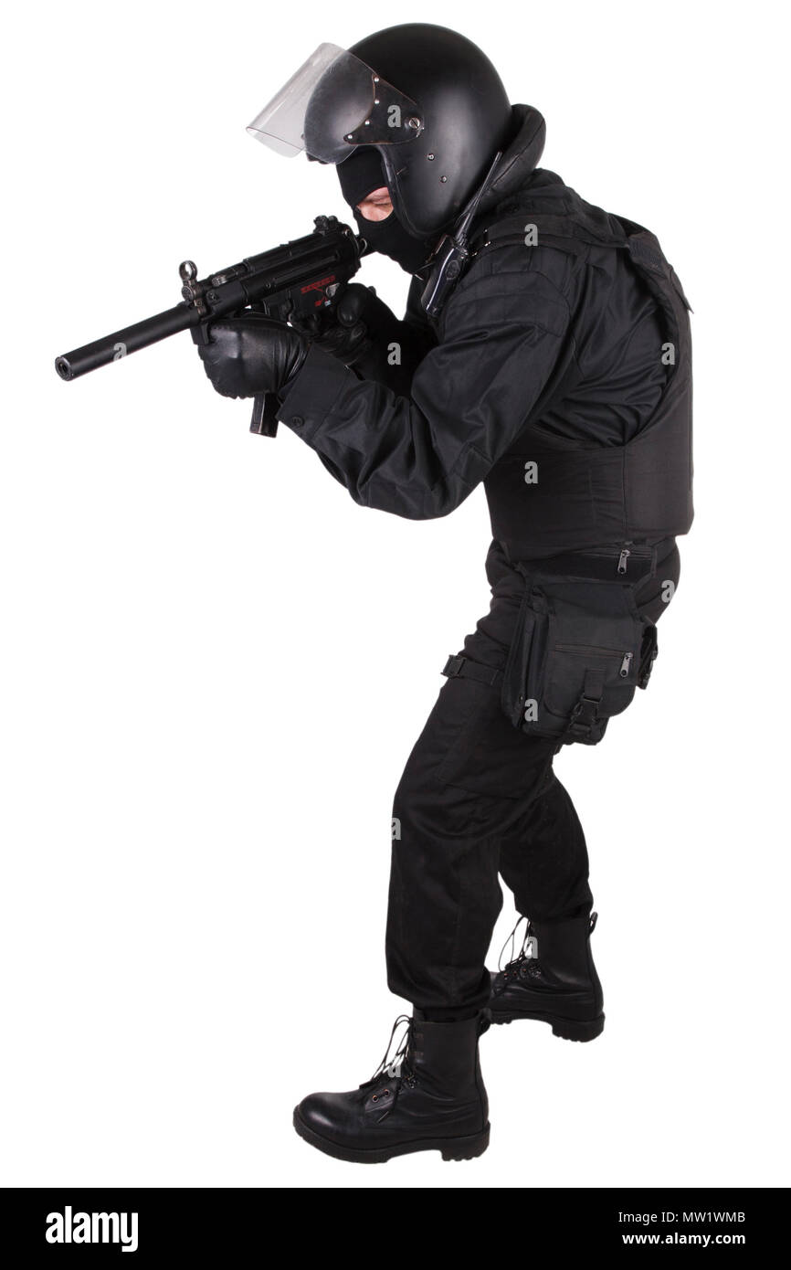 police special forces officer with submachine gun in black uniform ...