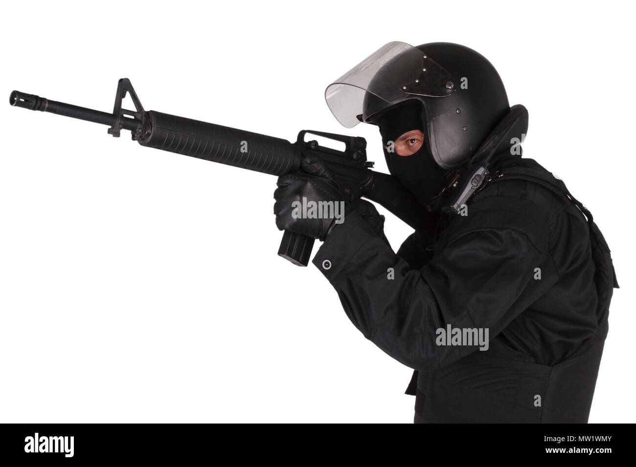 SWAT officer with assault rifle in black uniform isolated on white ...