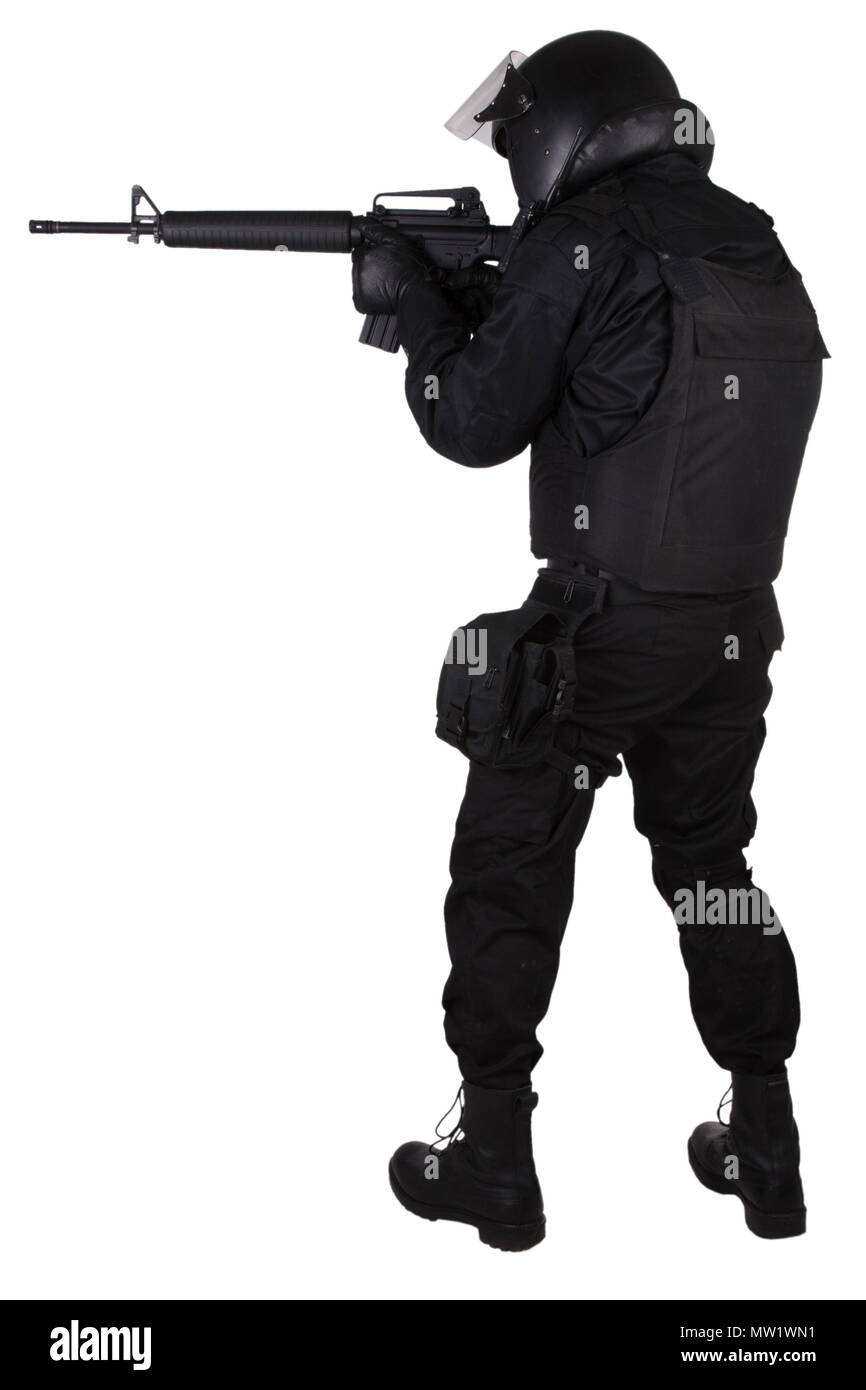 SWAT officer with assault rifle in black uniform isolated on white ...