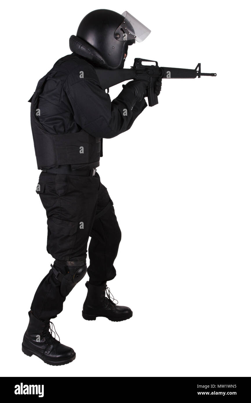 SWAT officer with assault rifle in black uniform isolated on white ...