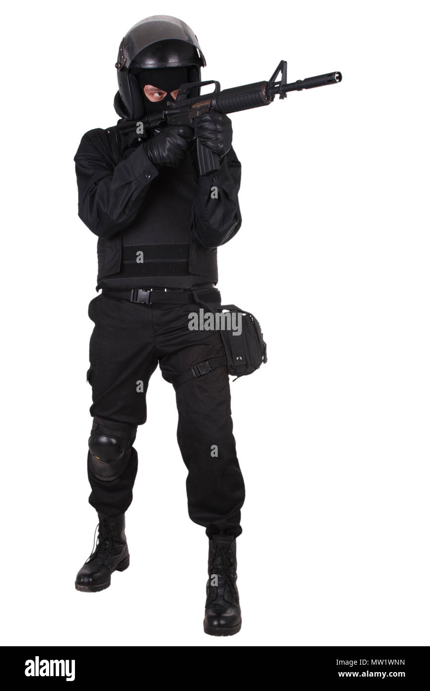 SWAT officer with assault rifle in black uniform isolated on white ...