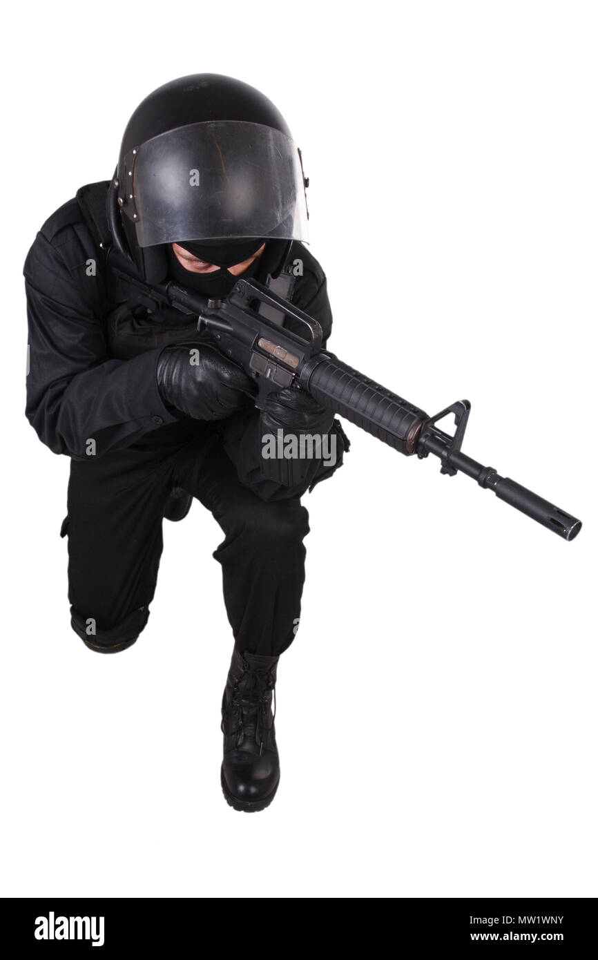 SWAT officer with assault rifle in black uniform isolated on white ...