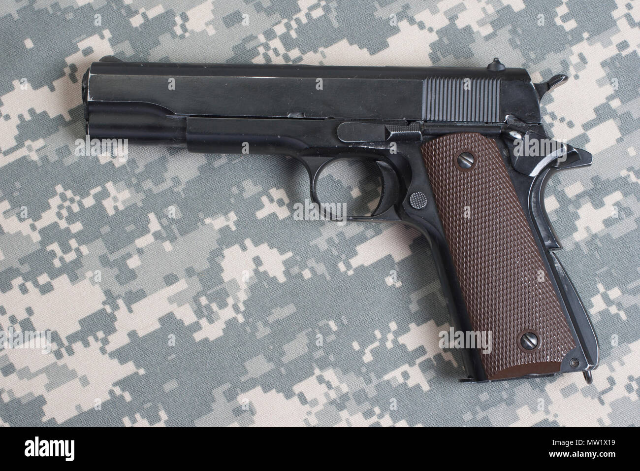 colt M1911 handgun on camouflage uniform Stock Photo - Alamy