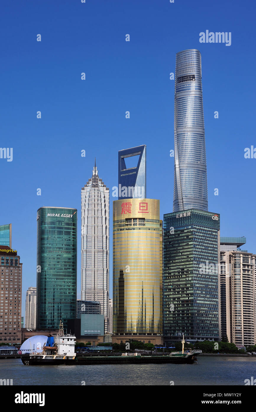 Close-up view of Pudong skyline over the Huangpu River with barge ...