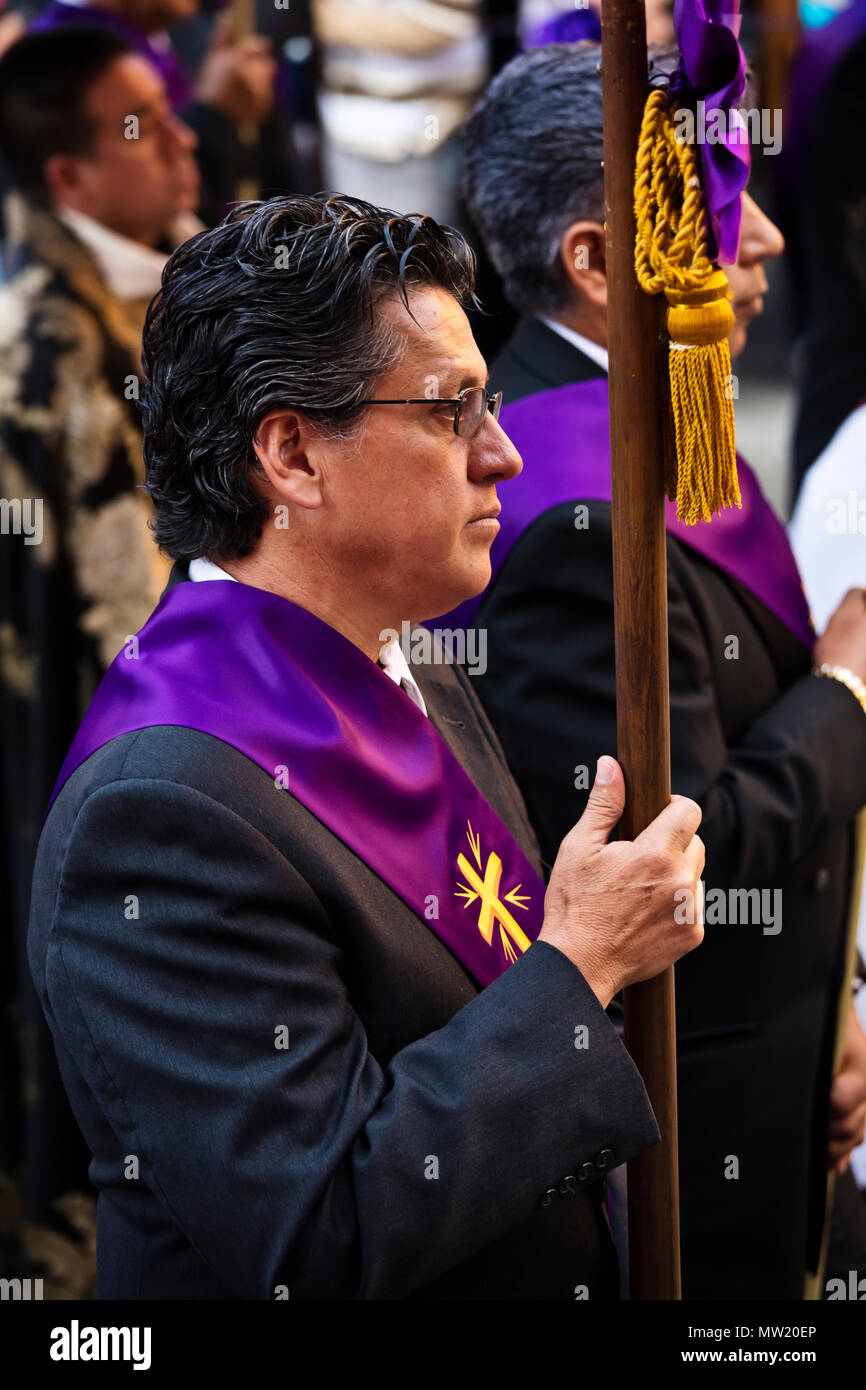 A Mexican man carries a banner in the Good Friday Procession, known as ...