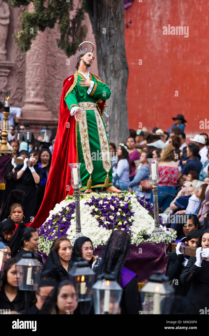 A statue of a saint is carried in the Good Friday Procession, known as ...