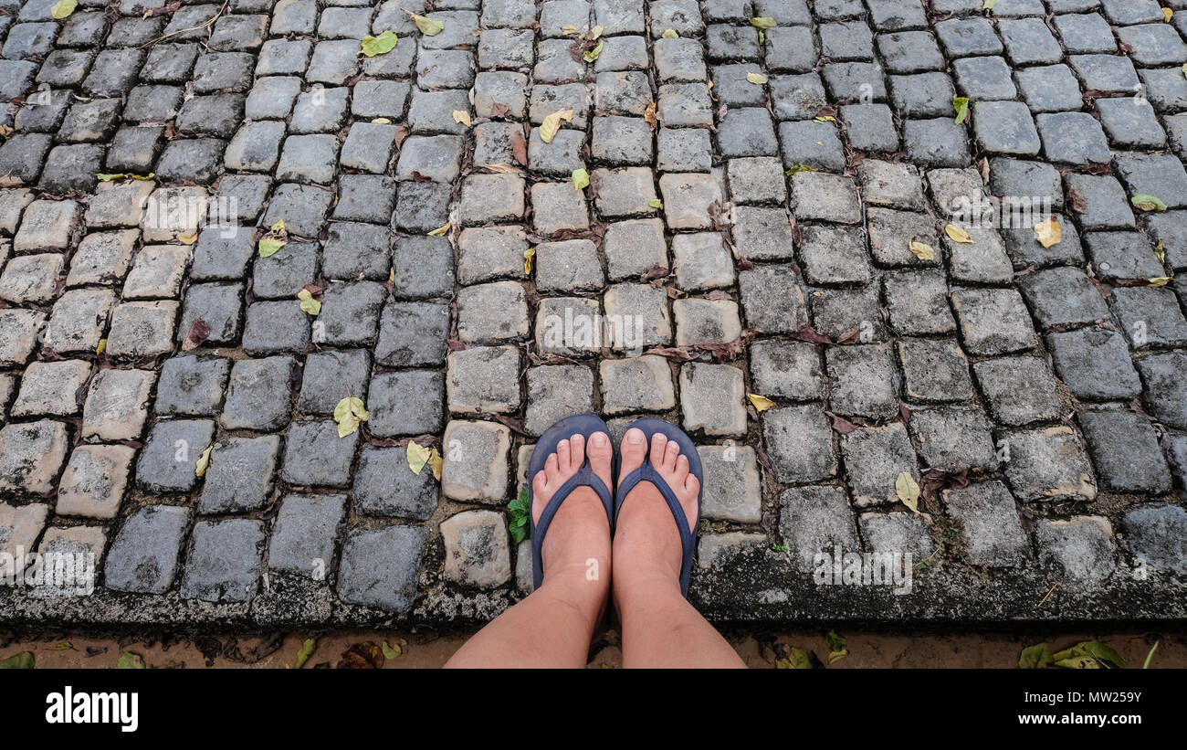 Woman foot on stone path at the park in Colombo, Sri Lanka Stock Photo ...
