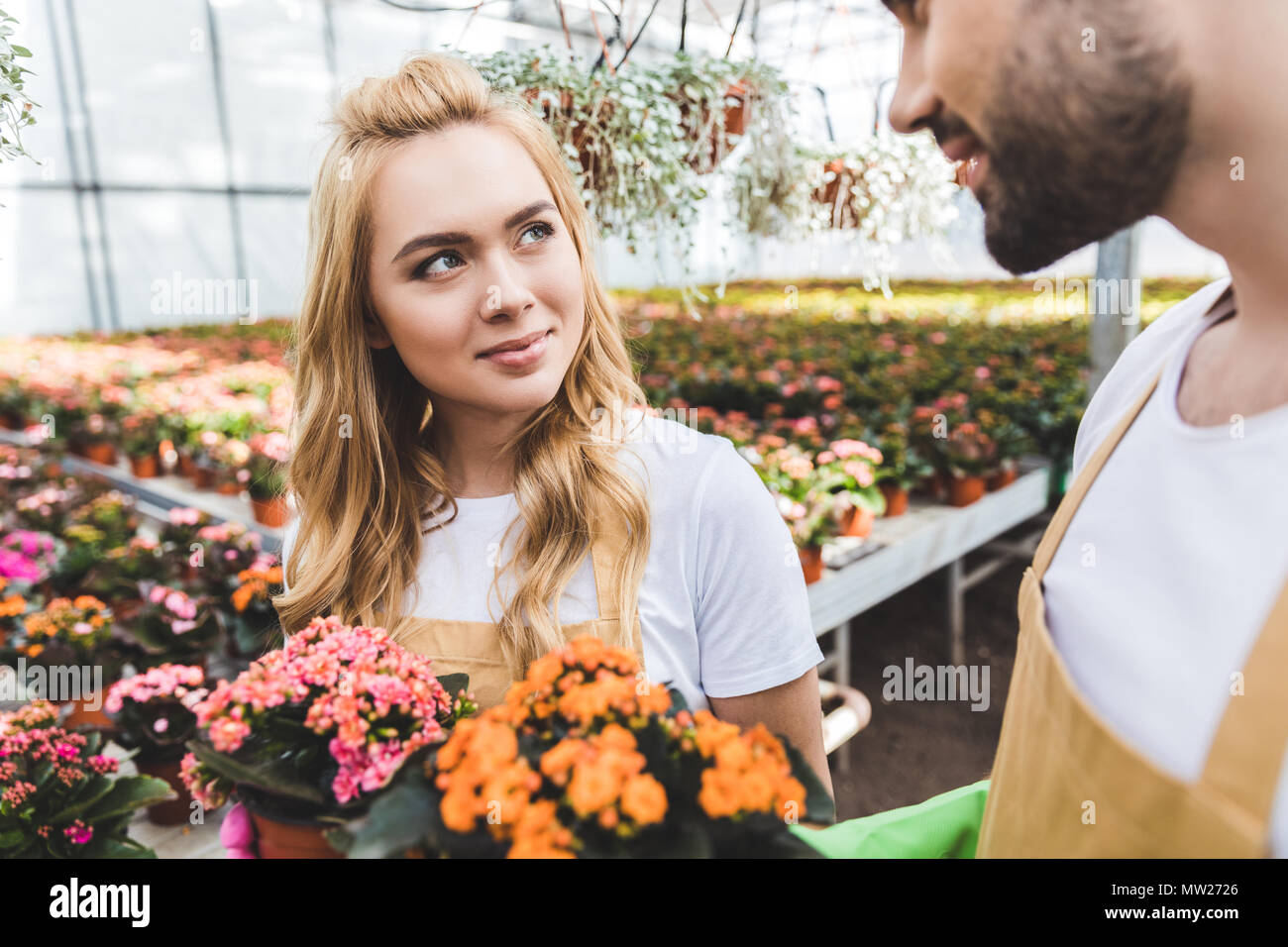 Male female gardeners holding hi-res stock photography and images - Alamy