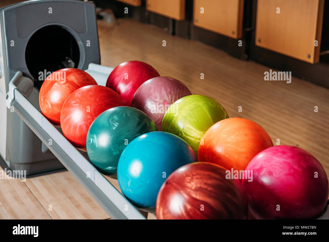 close-up shot of stand with colorful bowling balls in club Stock Photo ...