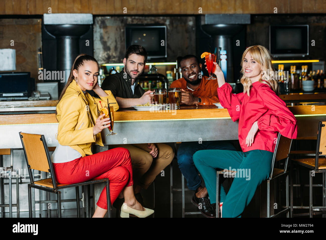 Group friends drinking cocktails beer hi-res stock photography and ...