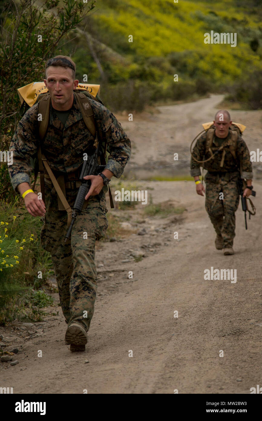 U.S. Marine Corps Capt. Cameron Heard, left, and U.S. Marine Corps ...