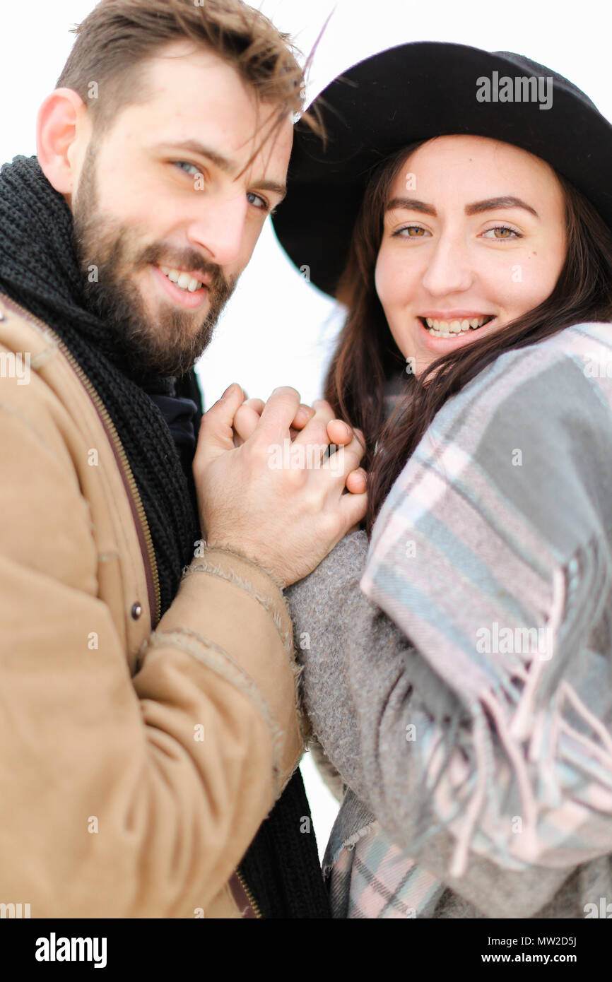 Portrait of couple wearing scarf and hat in white background Stock ...