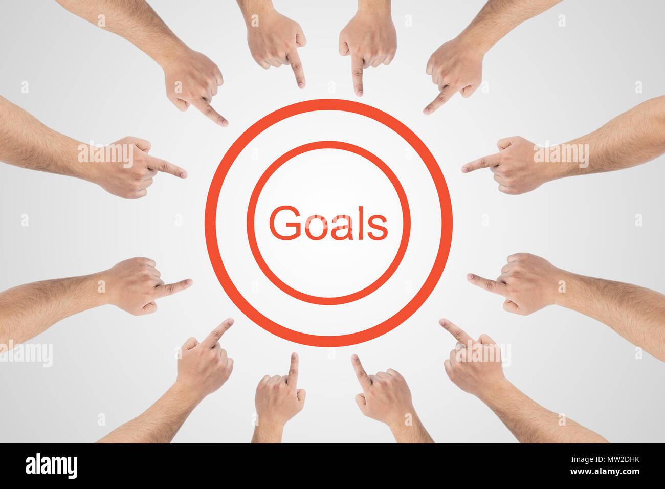 Hands pointing to word - goals.Goals achievement concept on white ...