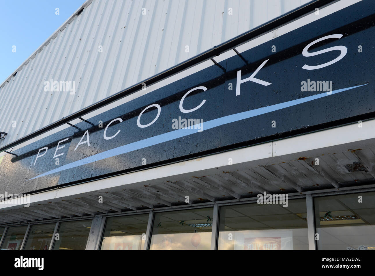 Outside and inside of Peacocks retail chain that sells clothing and ...